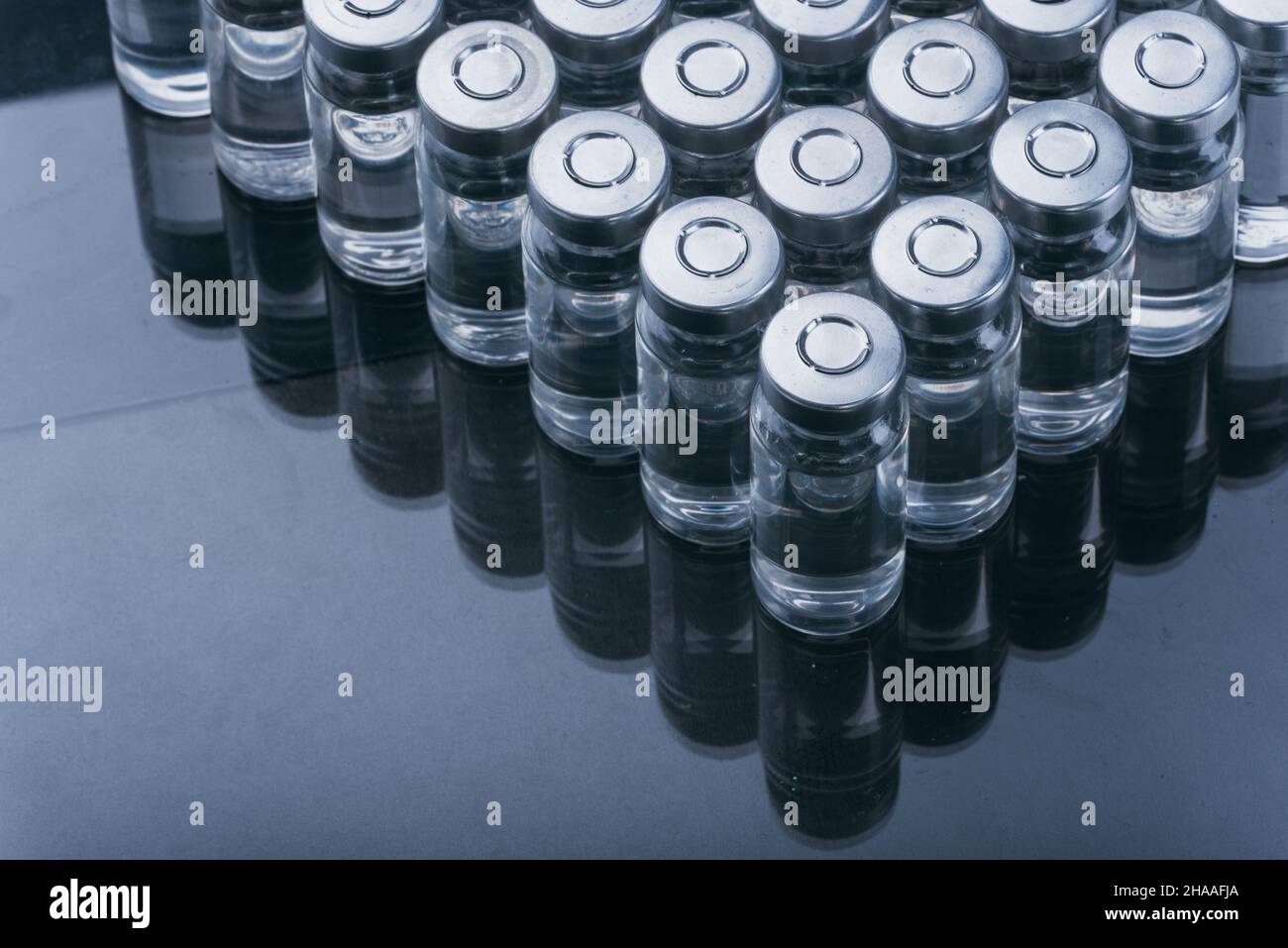 Glass medical ampoule vial for injection. Medicine is dry white drug ...