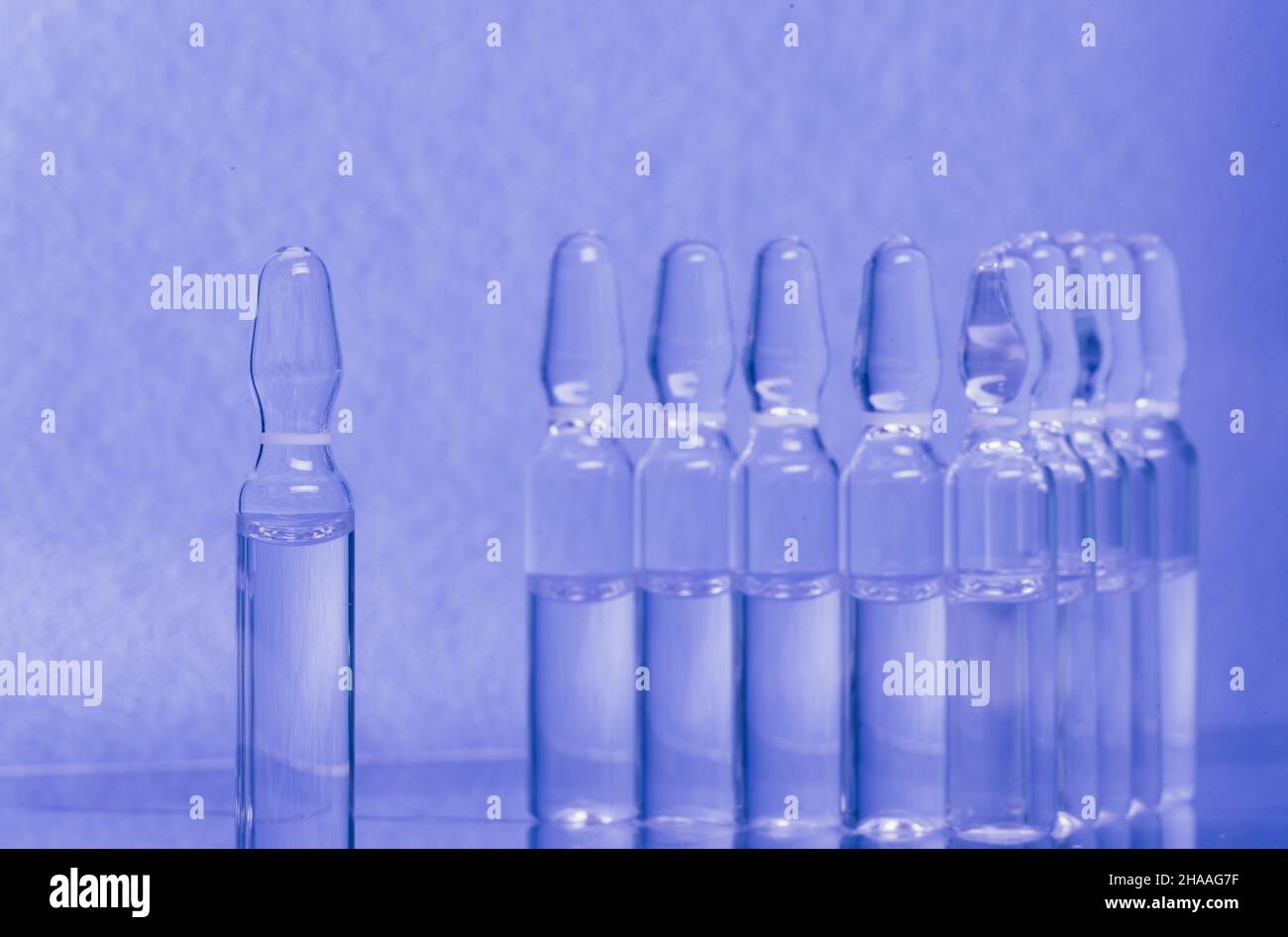Glass medical ampoule vial for injection. Medicine is liquid sodium ...