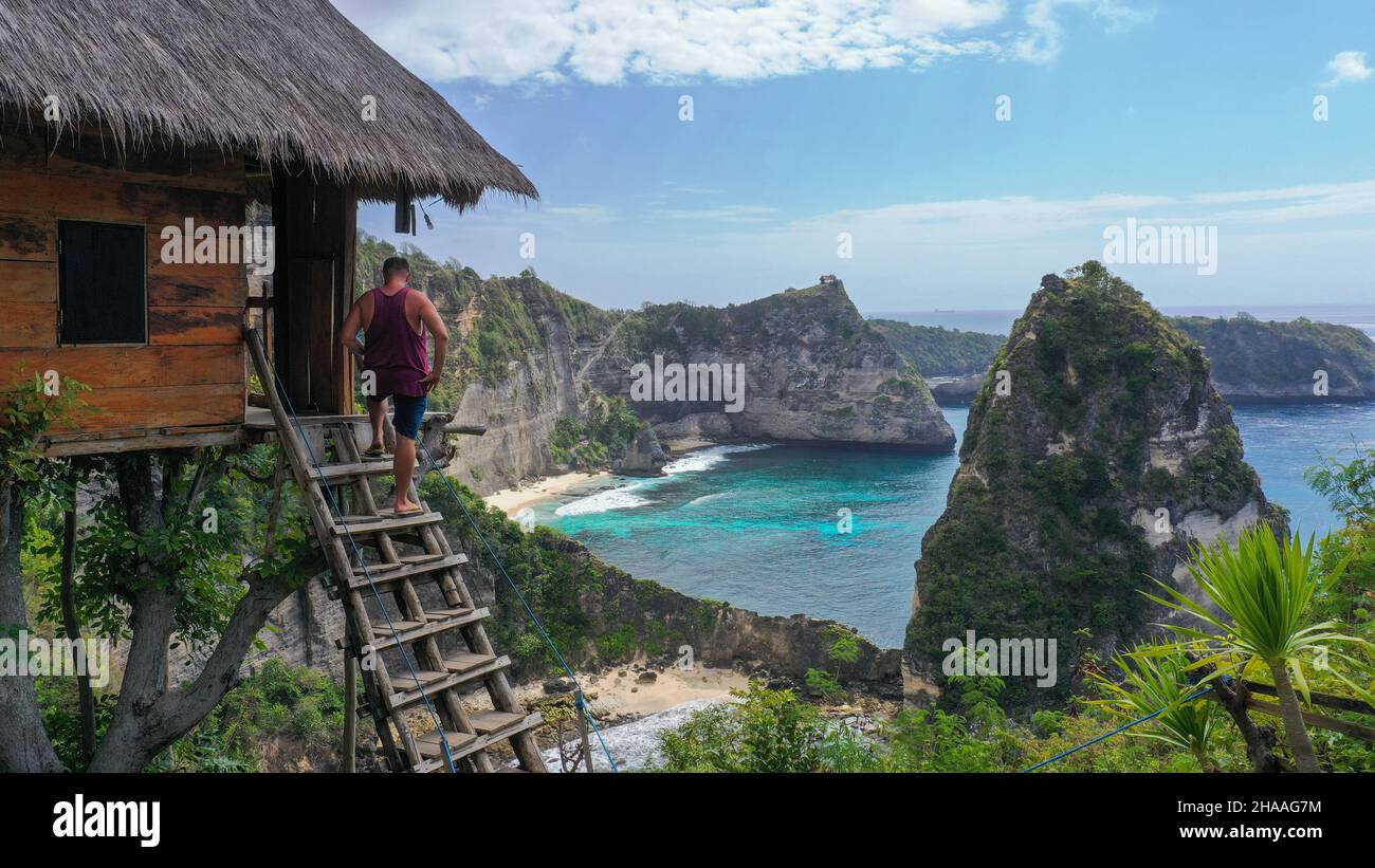 Tourist standing at the stairs of Tree on Rajalima. House Rumah Pohon ...