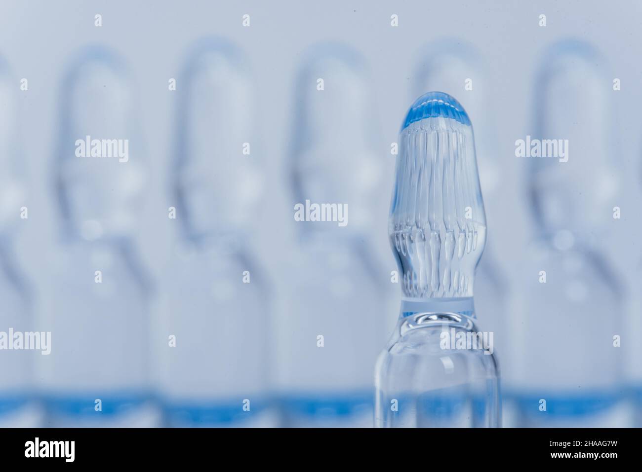 Glass medical ampoule vial for injection. Medicine is liquid sodium ...