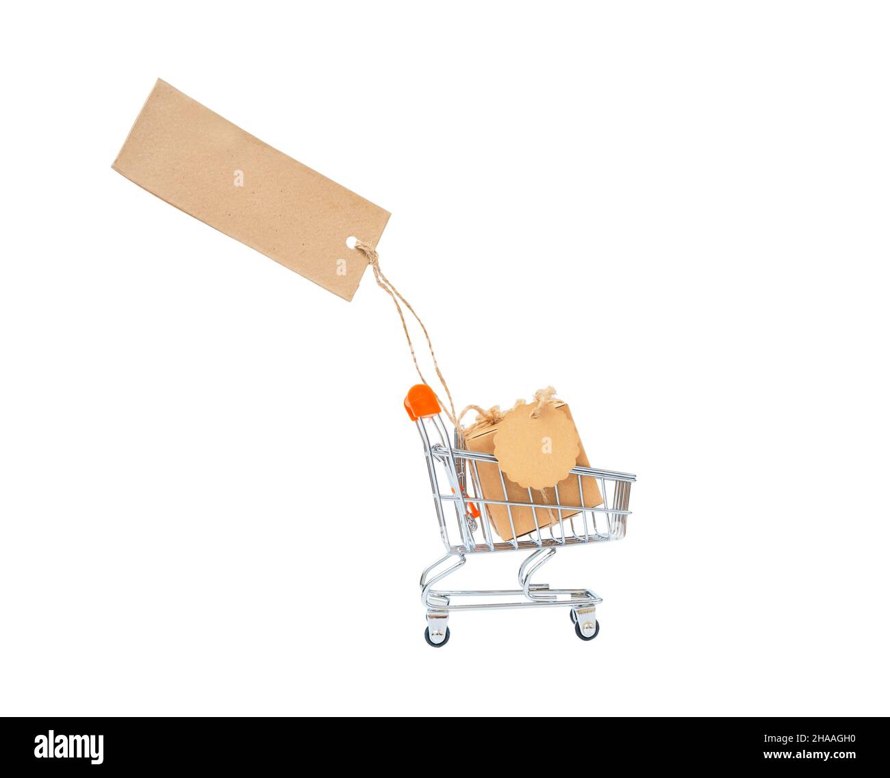 Shopping cart with cardboard box and price tag isolated on white ...