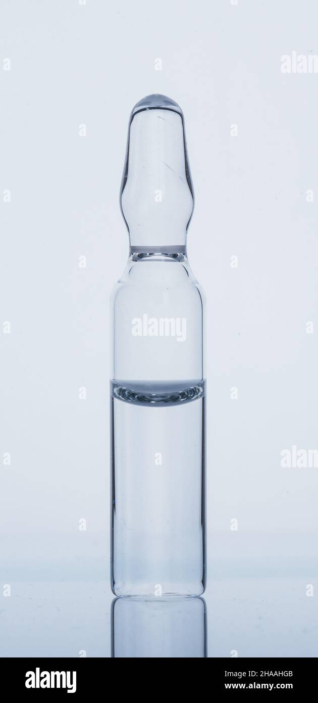 Glass medical ampoule vial for injection. Medicine is dry white drug ...
