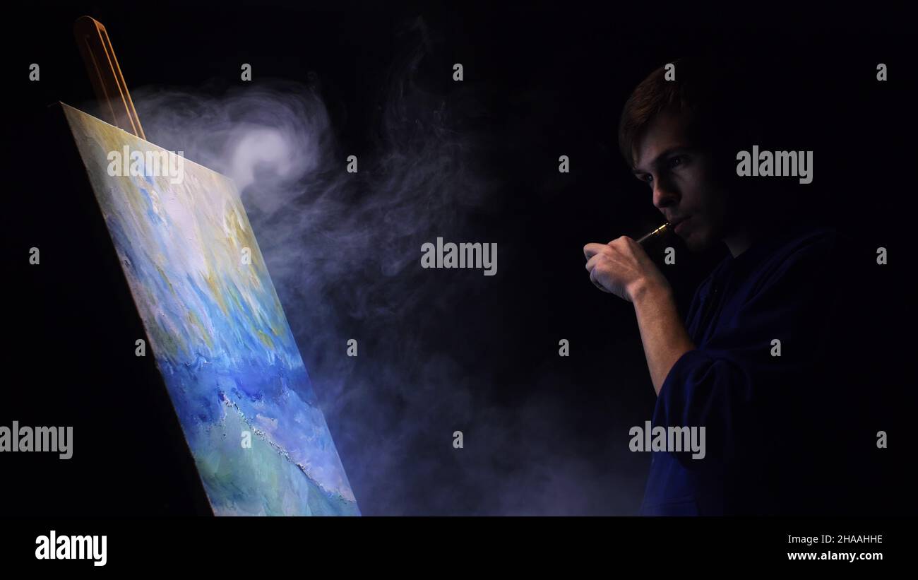 Artist copyist paint seascape with ship in ocean. Vaper smoke vape e ...