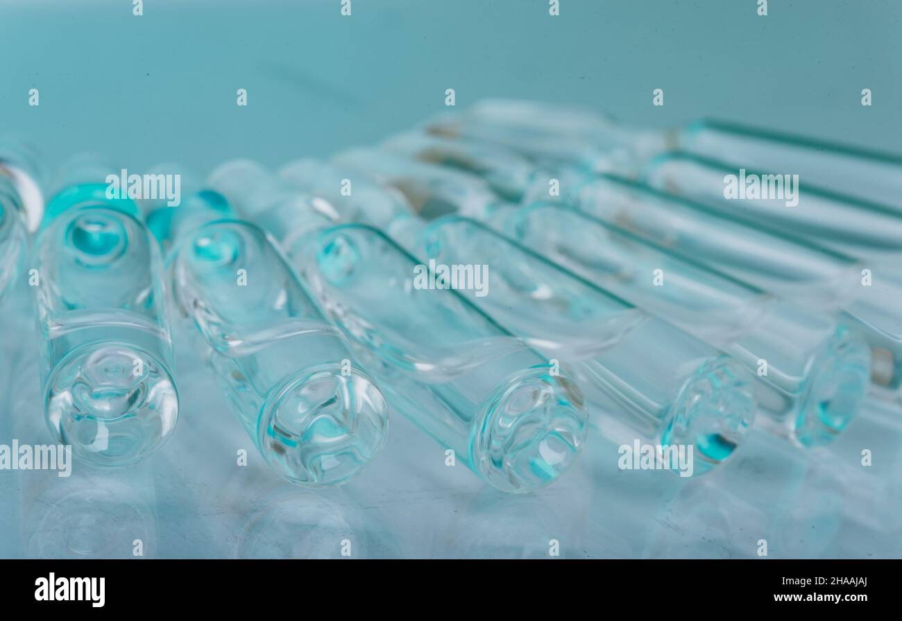Glass medical ampoule vial for injection. Medicine is liquid sodium ...