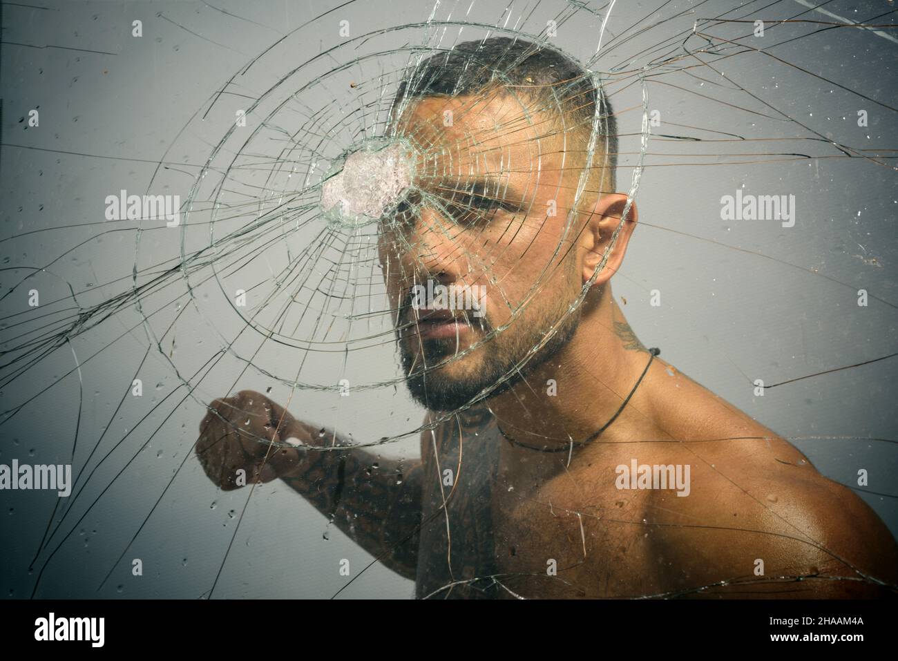 Gangster man, cracked glass. Ready to fight. Man boxing, strength and ...