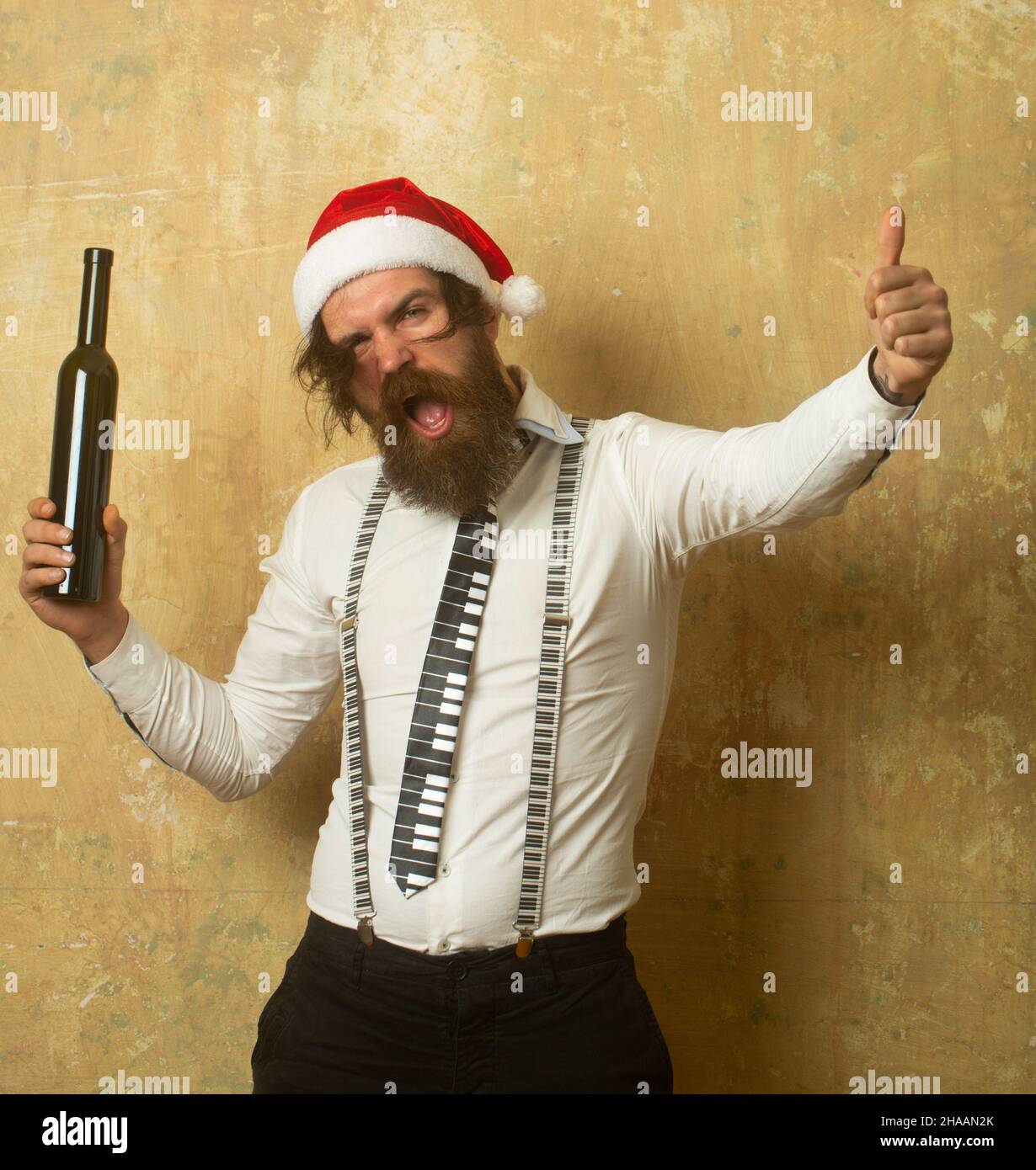 Bad drunk santa. Funny excited Santa drinking alcohol in bottle over on ...