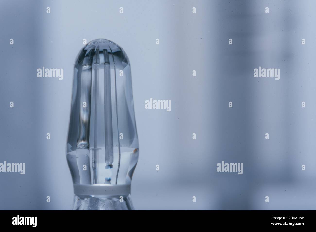 Glass medical ampoule vial for injection. Medicine is dry white drug ...