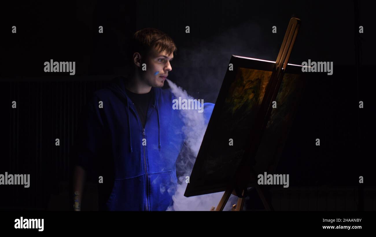 Artist copyist paint seascape with ship in ocean. Vaper smoke vape e ...