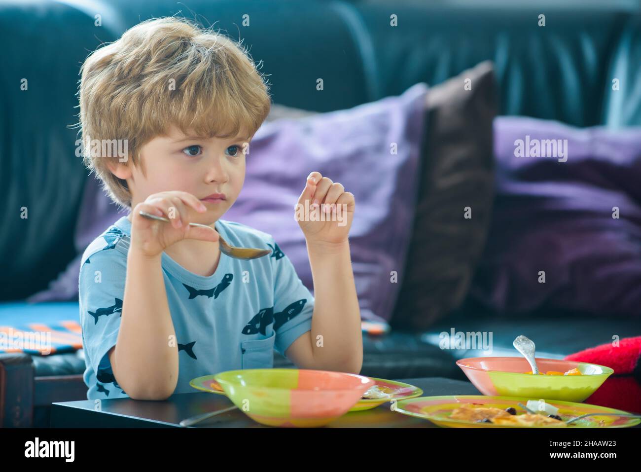 Cute baby food, babies eating. Kid boy eating healthy food Stock Photo ...