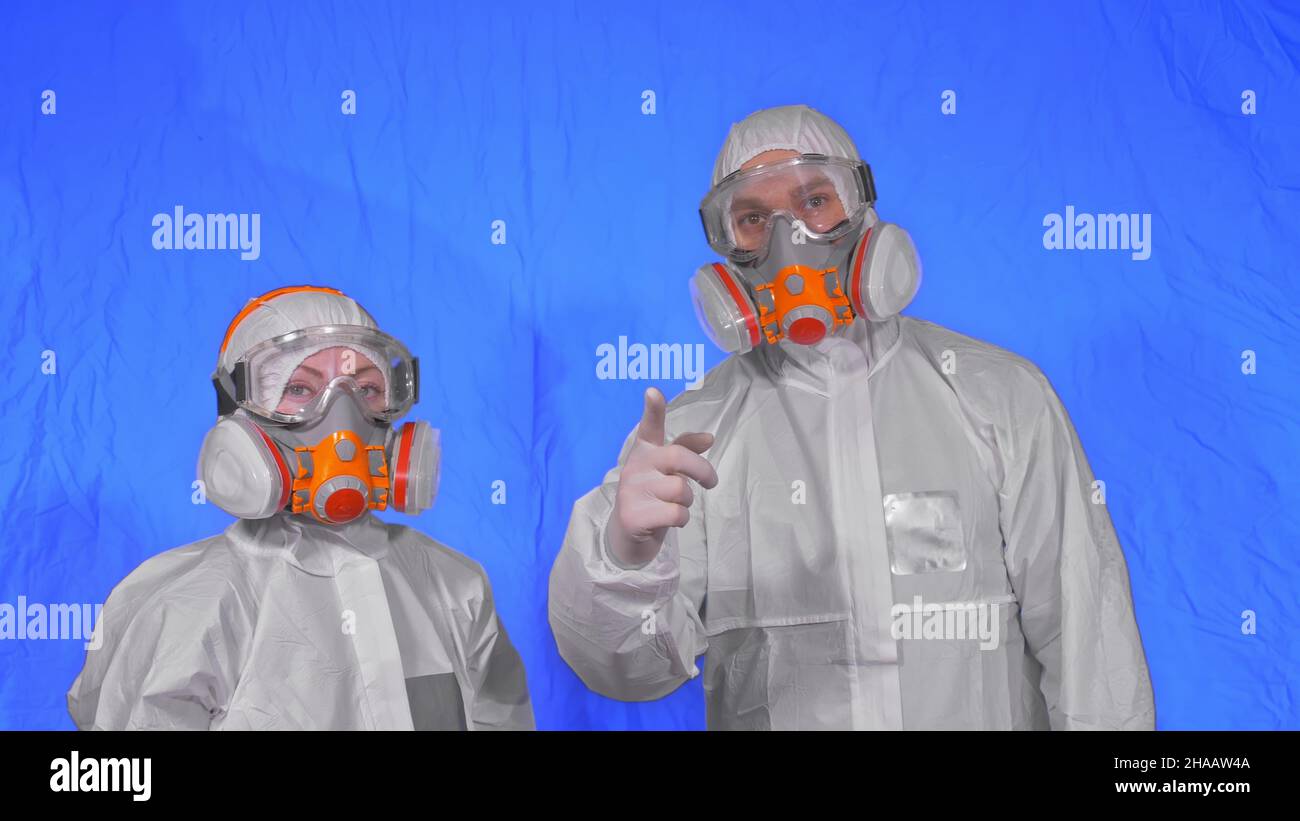 Doctor health worker in respirator. Slow motion. People portrait ...