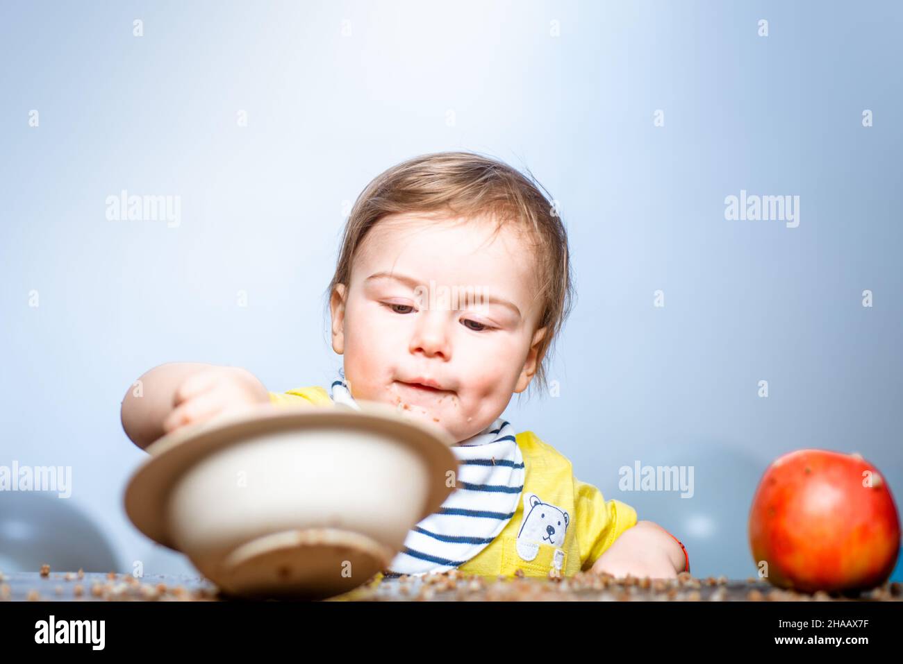 Cute funny babies eating, baby food. Funny kid boy with plate and spoon ...