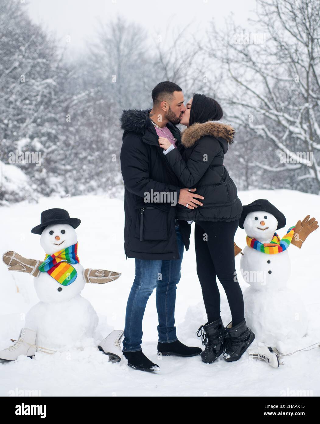 Couple kissing over winter background. Kiss on christmas background ...