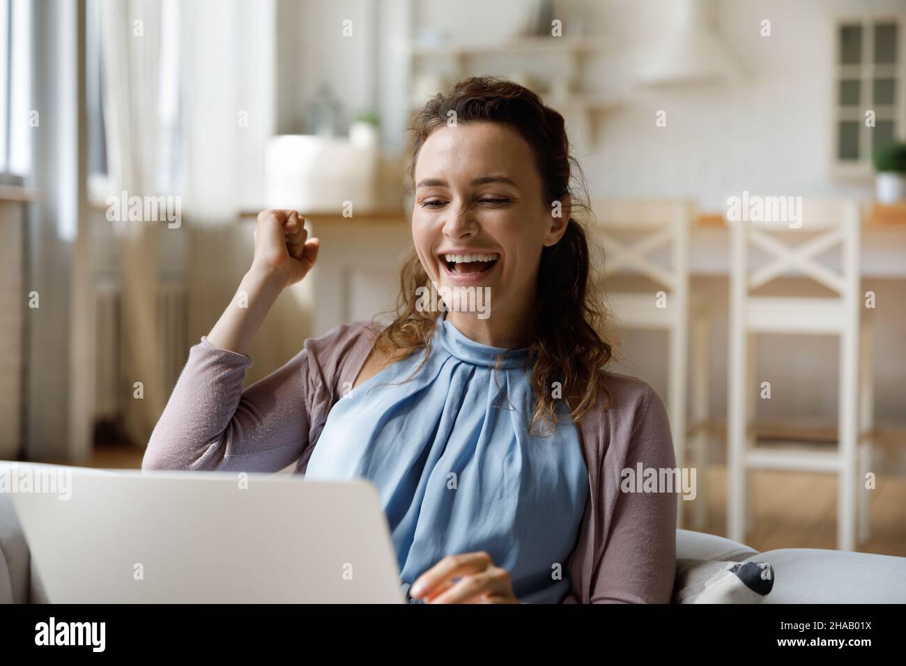 Happy cheerful millennial freelance woman feeling joy Stock Photo - Alamy