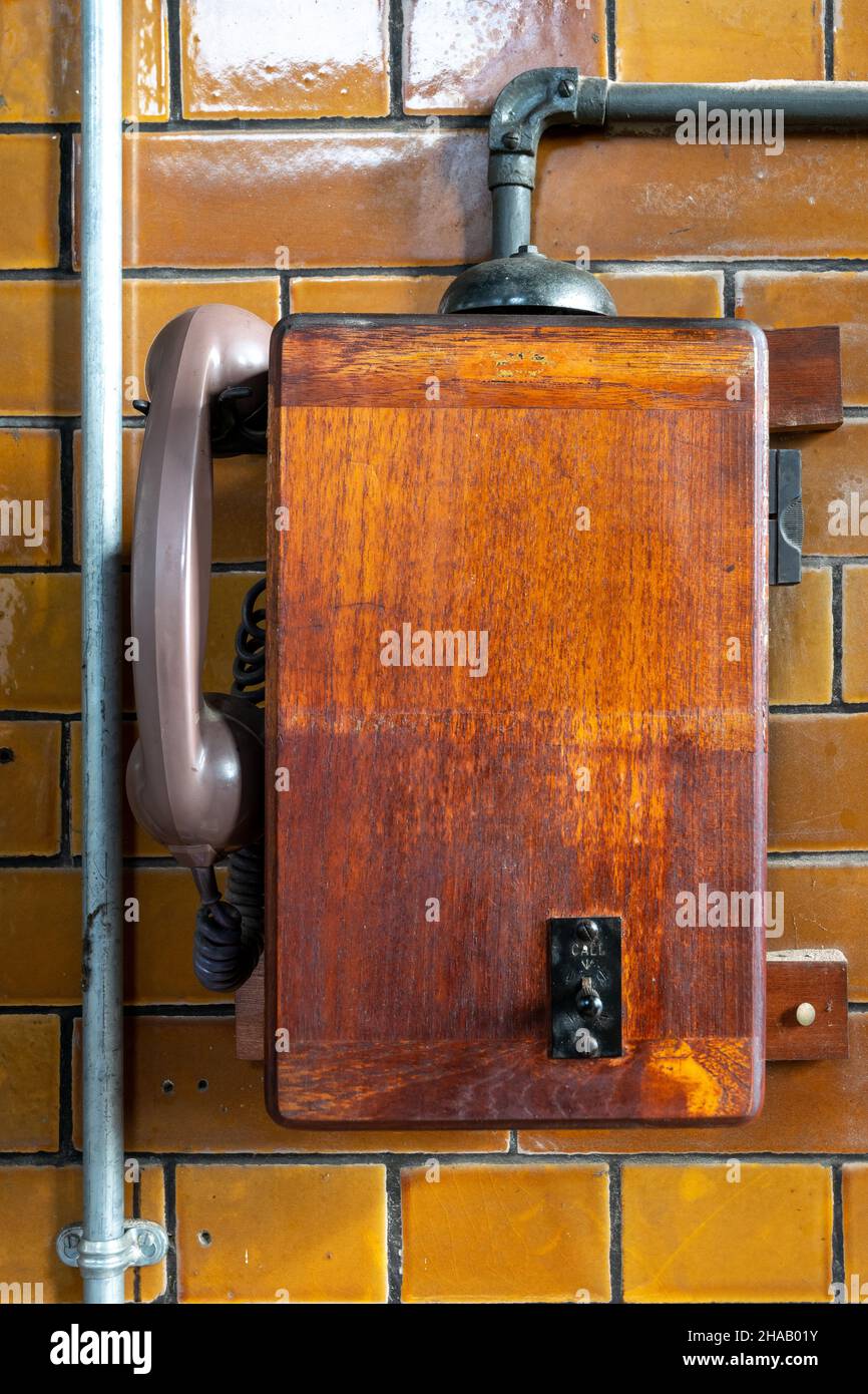 Old wooden railway substation telephone mounted on a wall Stock Photo ...