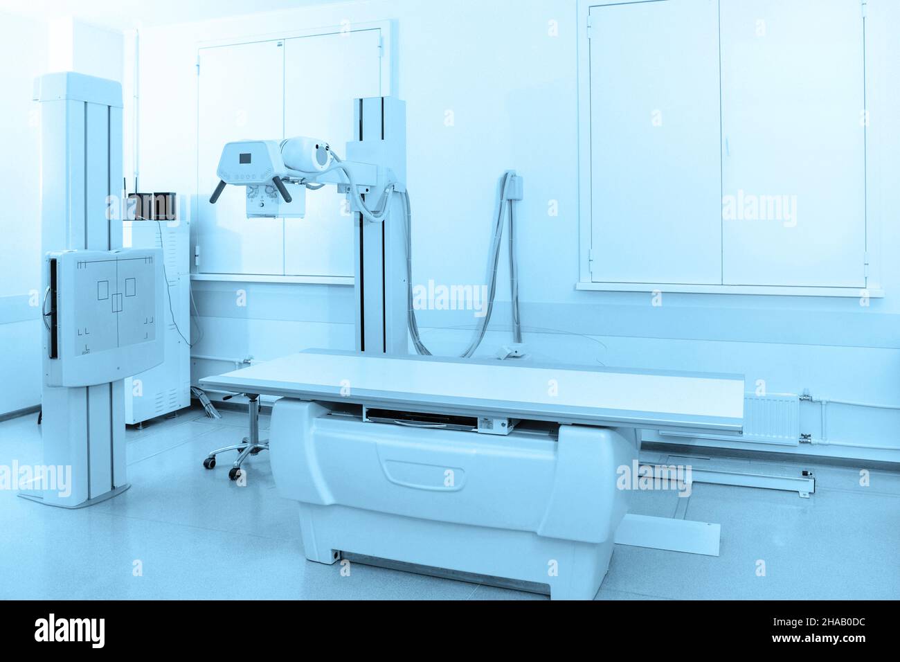 X-ray department in modern hospital. Radiology room with scan machine ...