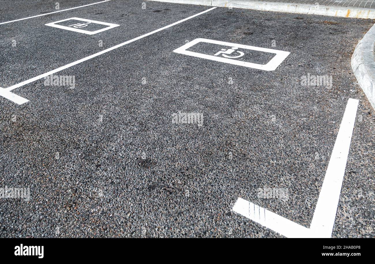 Parking places with handicapped or disabled signs and marking lines on ...