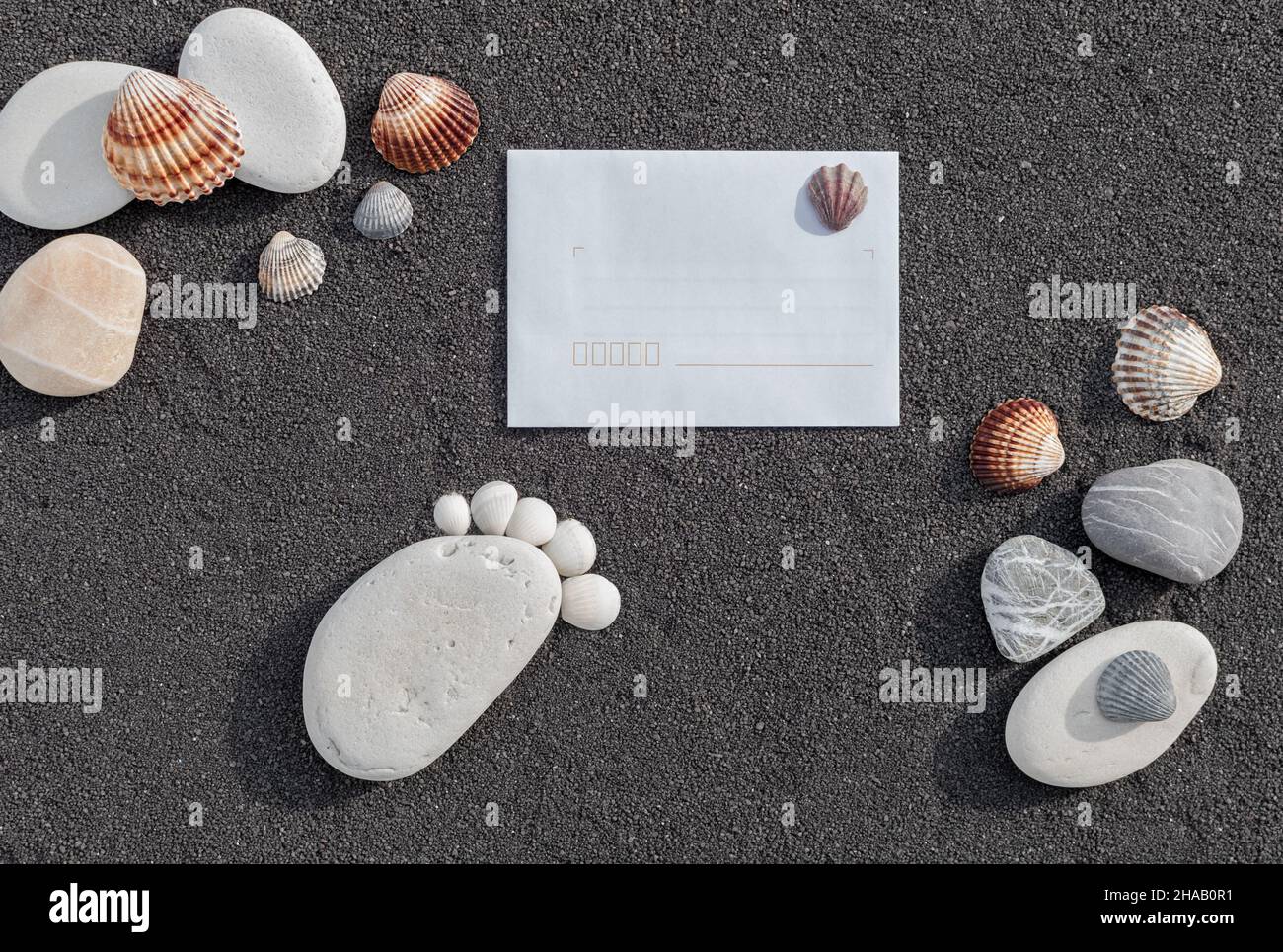 Background grains of sea sand, beach sand with envelope and pebble ...