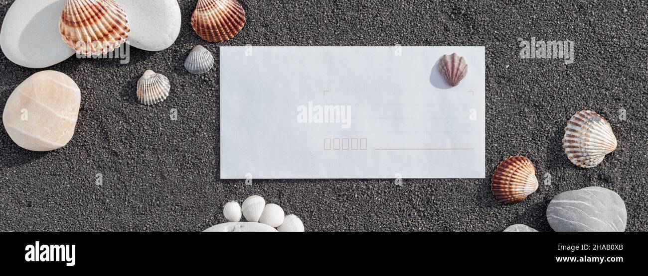 Background grains of sea sand, beach sand with envelope and pebble ...