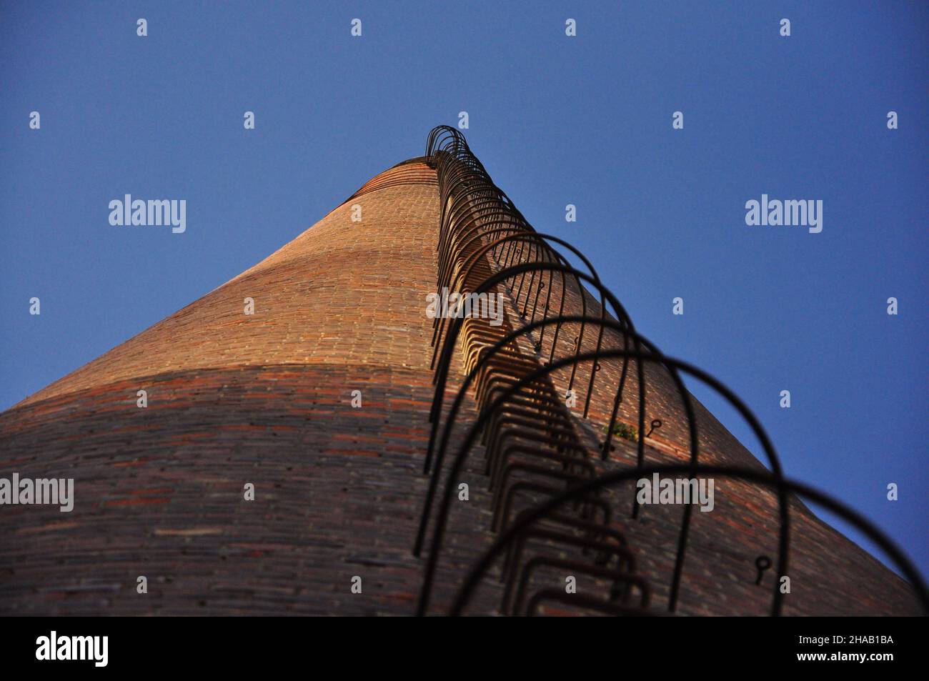 Industrial old brick chimney without smoke and blue sky,stairs that ...