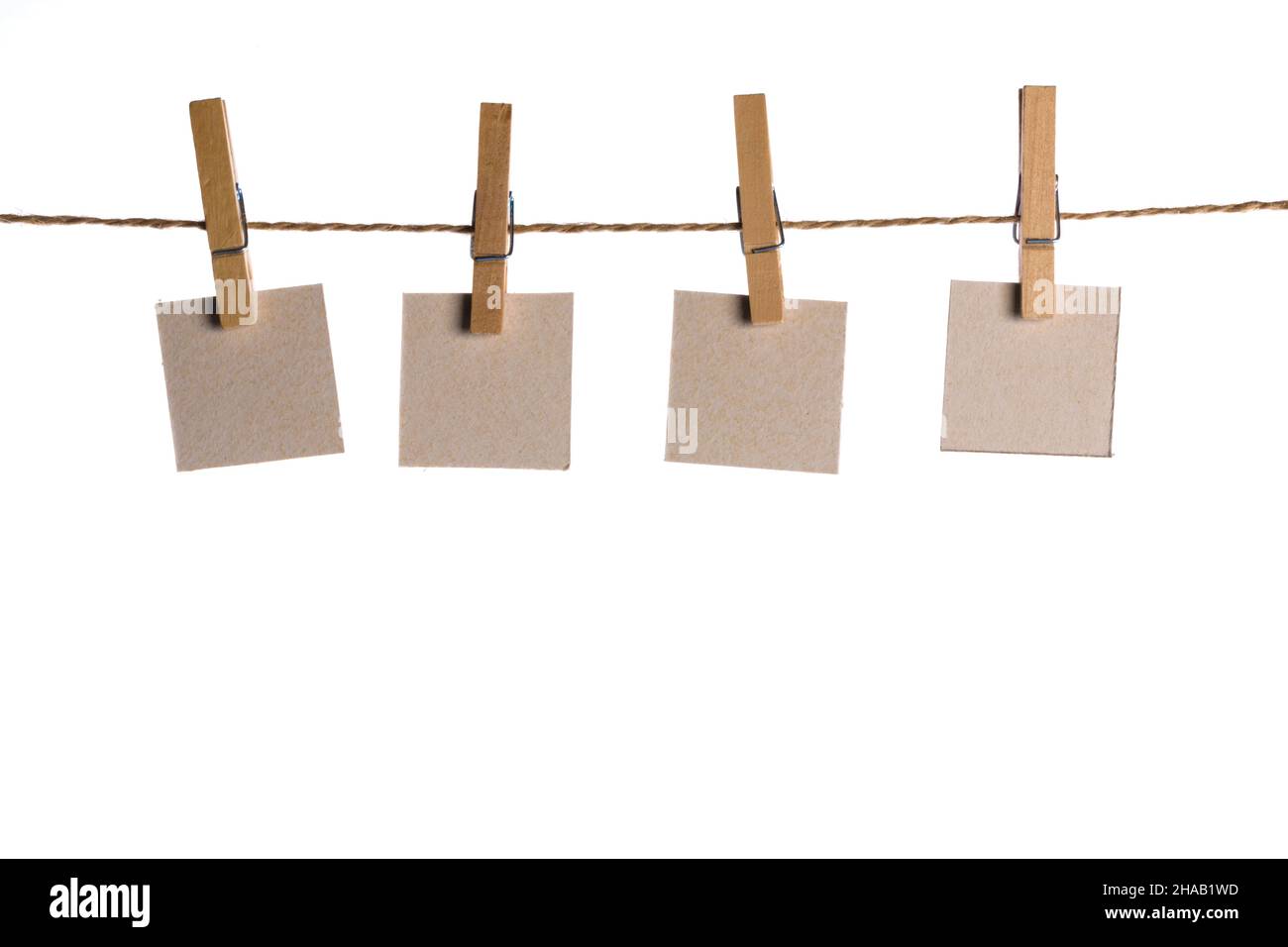 4 Note paper cards hanging with wooden clip or clothespin on rope ...