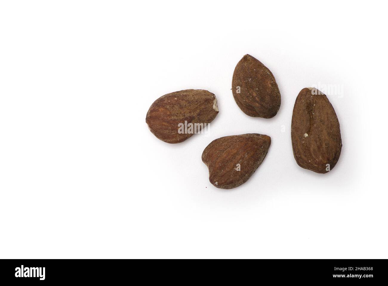 Four almonds without shells isolated on white background Stock Photo ...