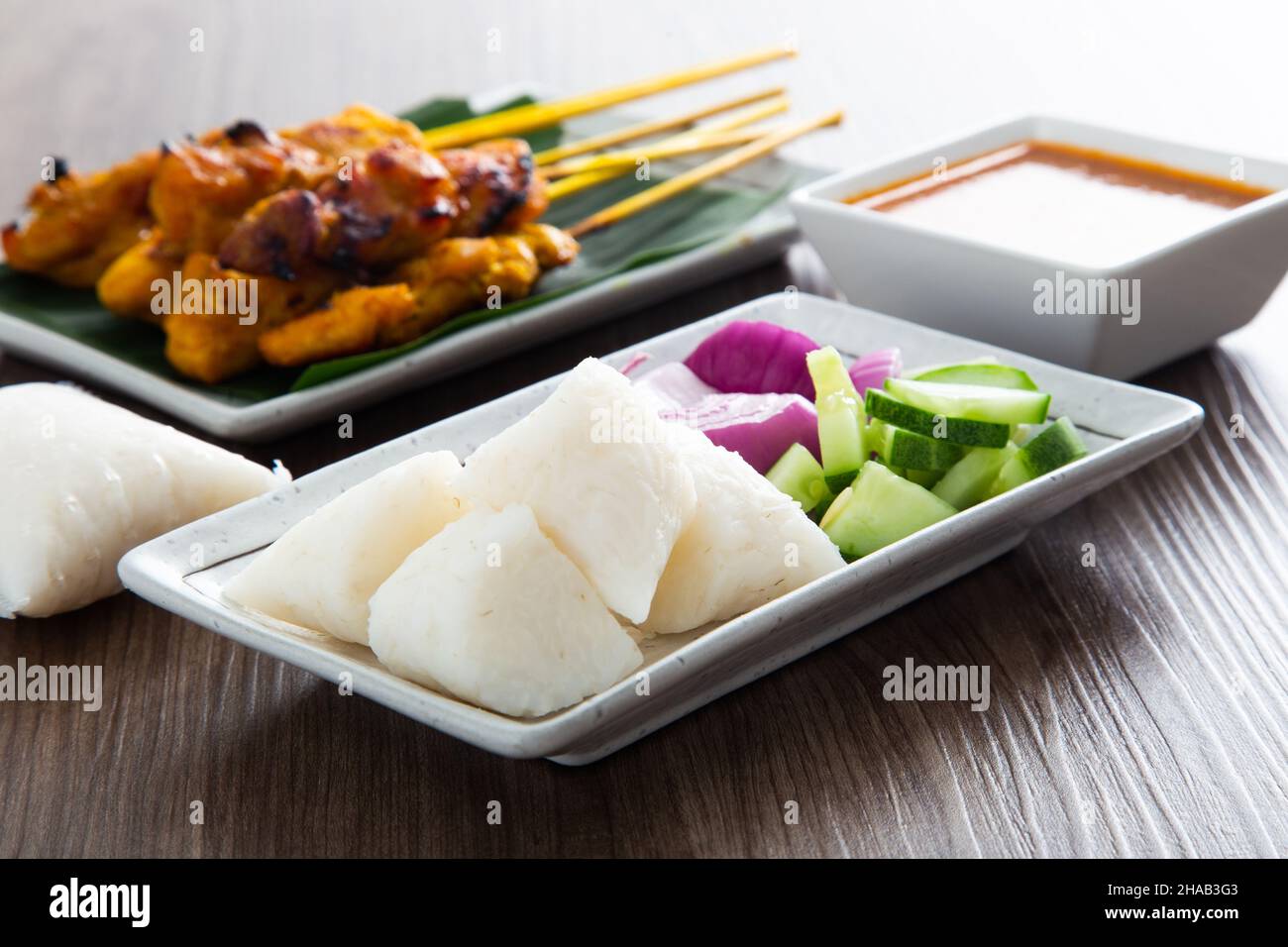 Nasi Himpit or rice cube normally serve with spicy peanut sauce and ...