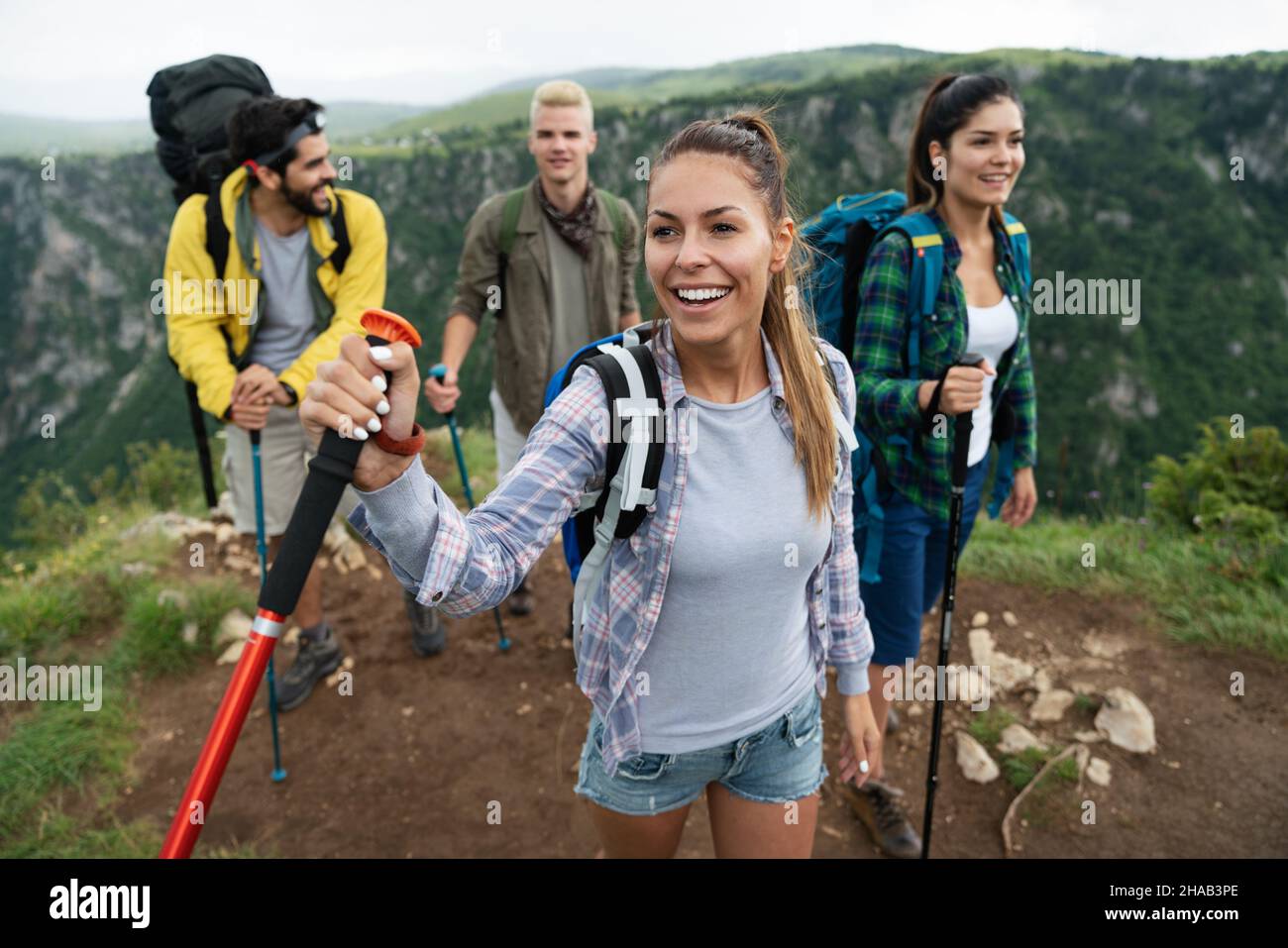 Group of happy friends enjoying outdoor activity together Stock Photo ...