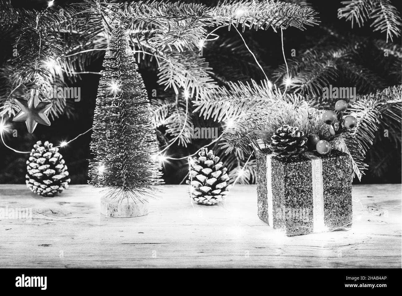 a Christmas box with a gift, a star and a small Christmas tree on the ...