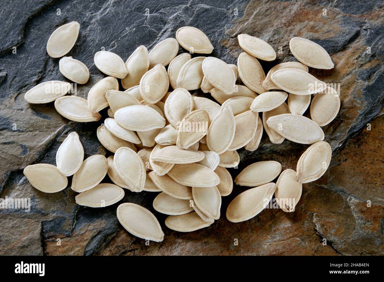 Pumpkin seeds from above on stone surface Stock Photo - Alamy