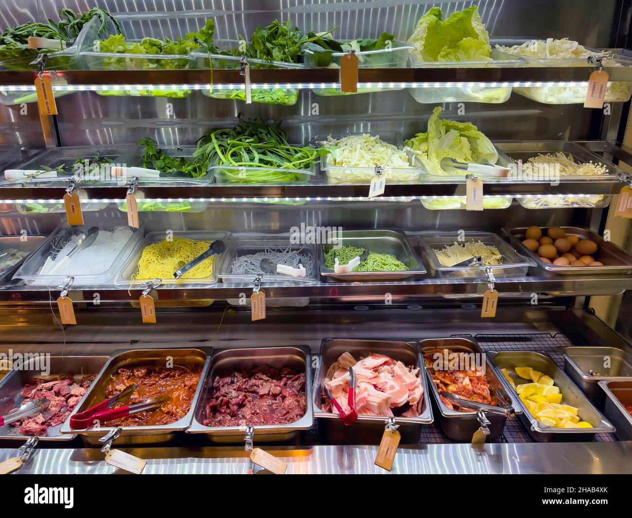 Asian hotpot fresh dishes display and Buffet trays Stock Photo - Alamy