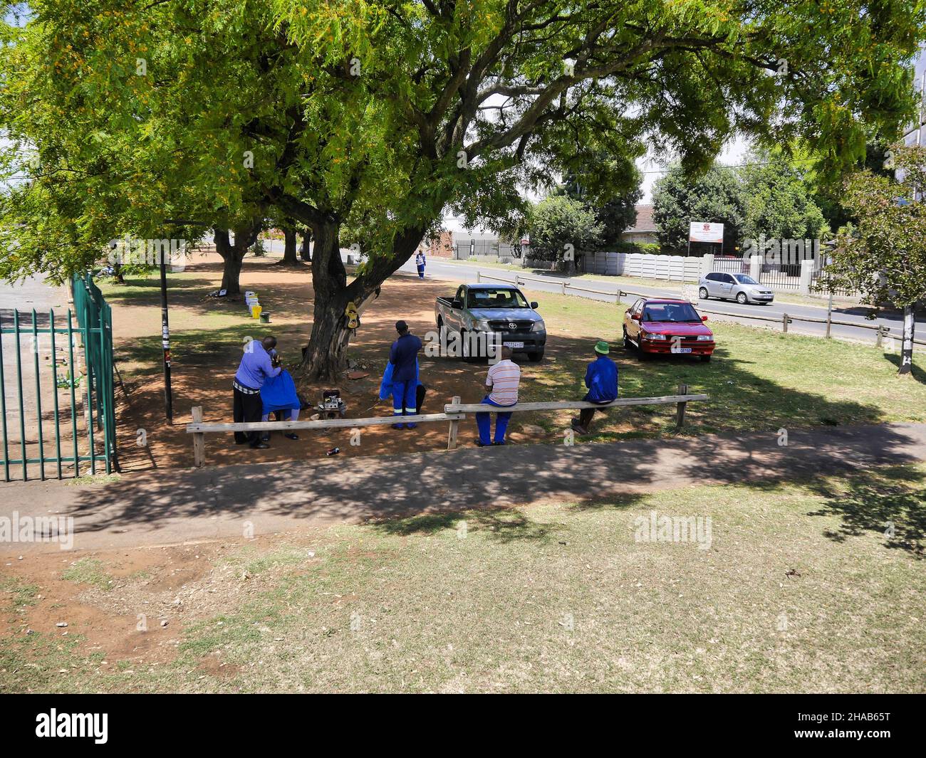 JOHANNESBURG, SOUTH AFRICA - Nov 04, 2018: An outdoor barbershop under ...