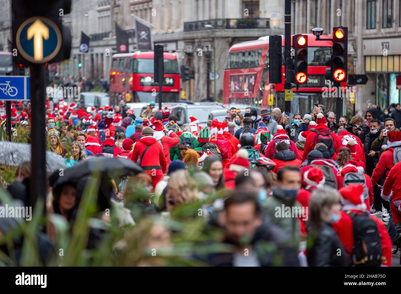 People dressed as Santa Claus seen cycling along Regent Street in ...