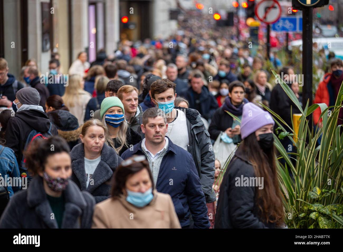 Shoppers wearing facemasks as a preventive measure against the spread ...