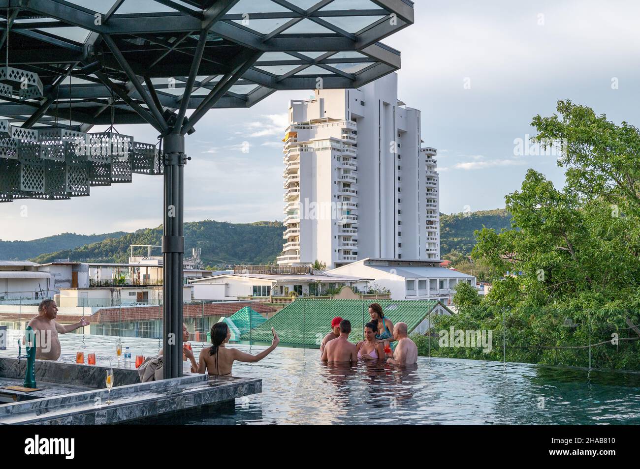 Rooftop bar and pool before sunset at Patong in Phuket. Patong is one ...