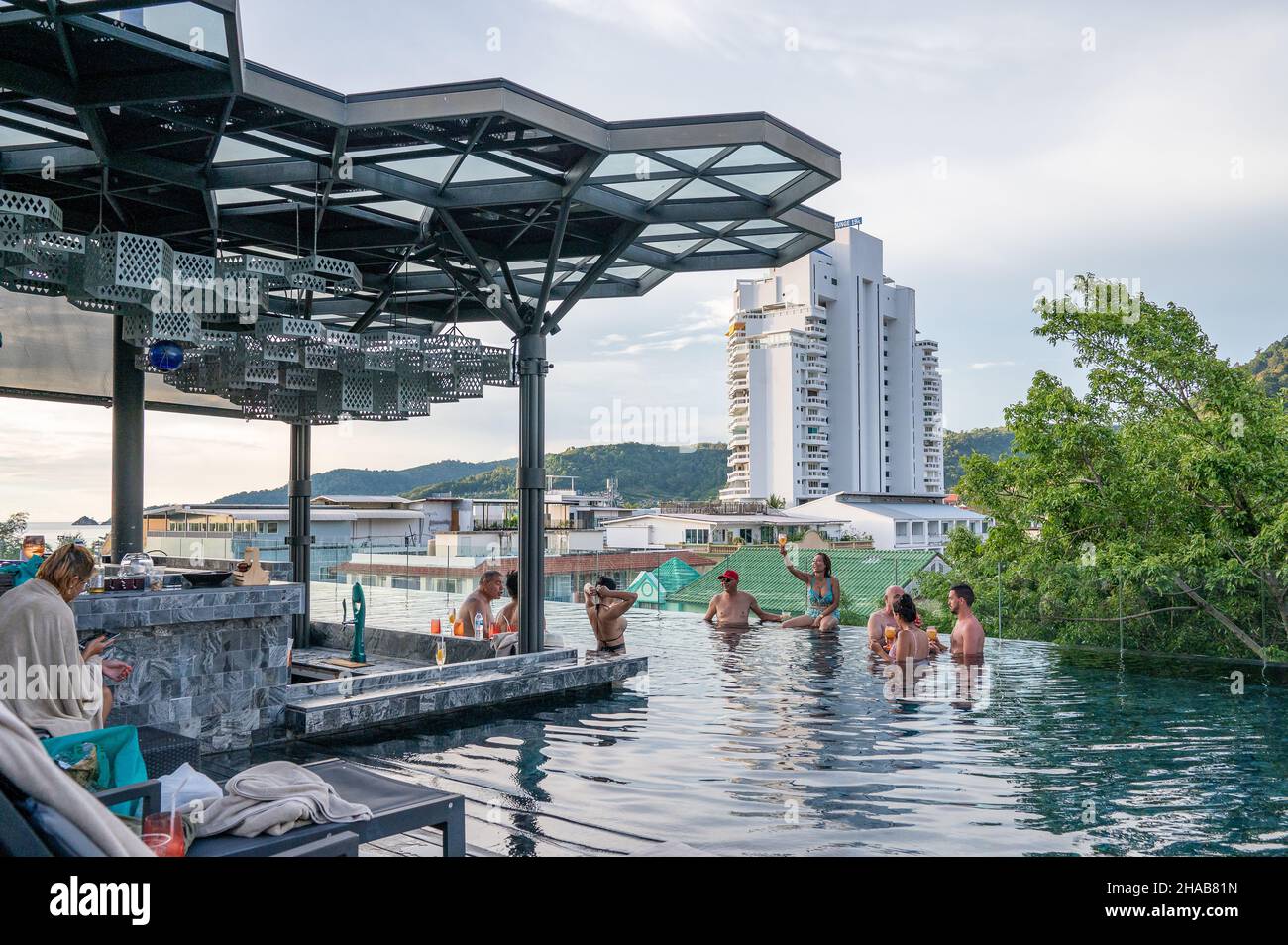 Rooftop bar and pool before sunset at Patong in Phuket. Patong is one ...
