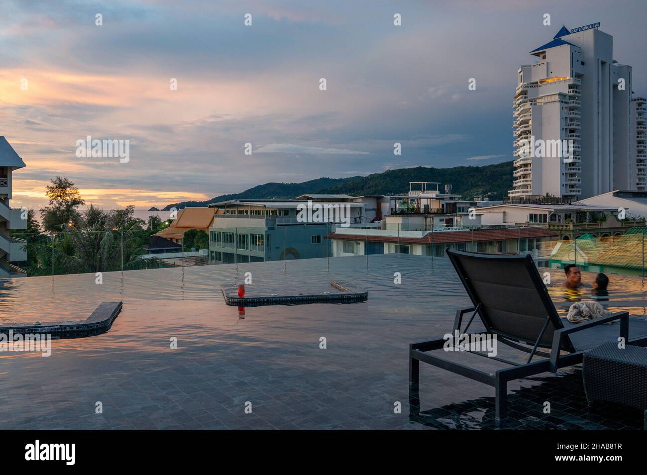 Rooftop bar and pool before sunset at Patong in Phuket. Patong is one ...