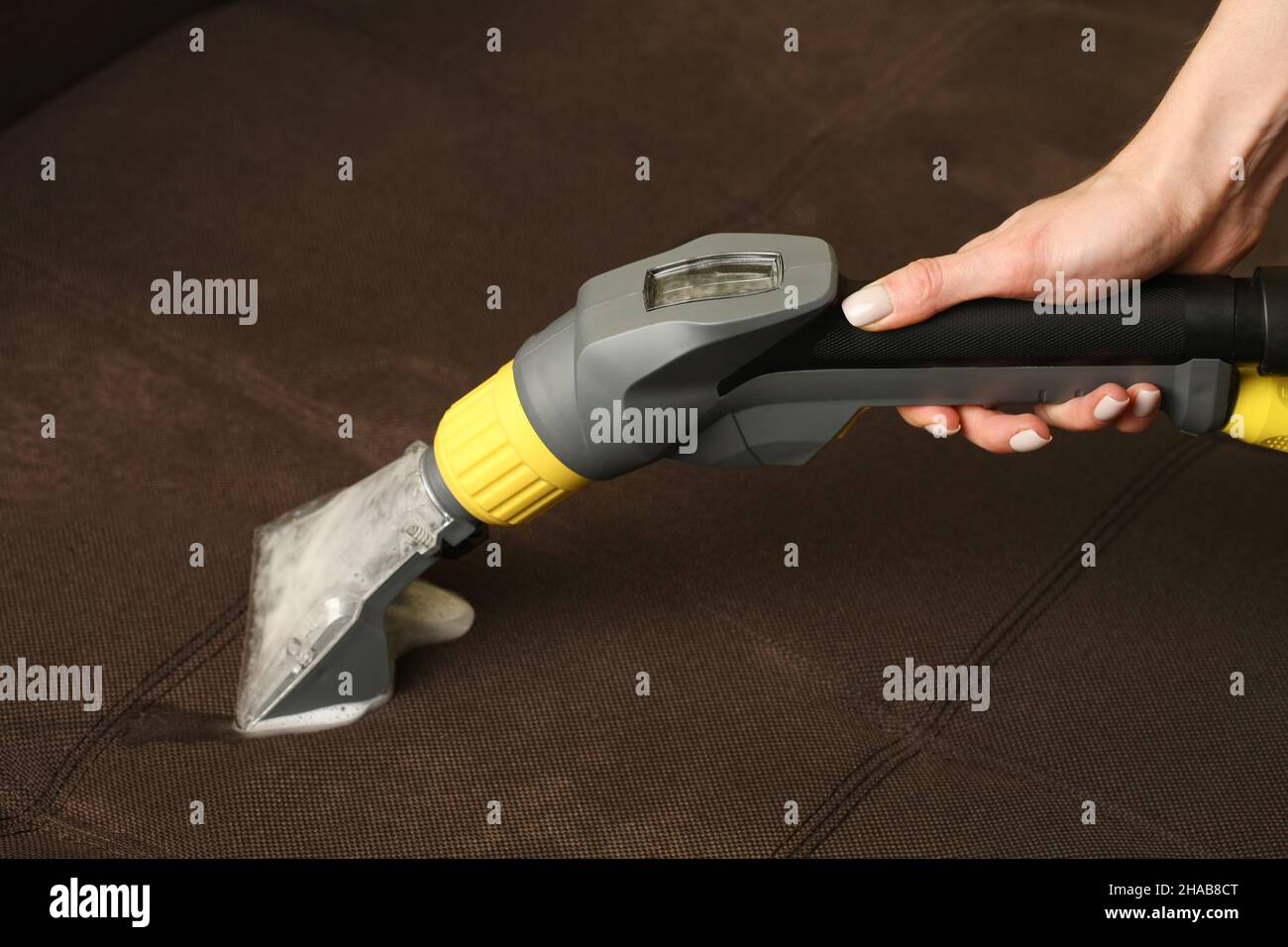 Deep professional cleaning of sofa with vaccum cleaner Stock Photo - Alamy