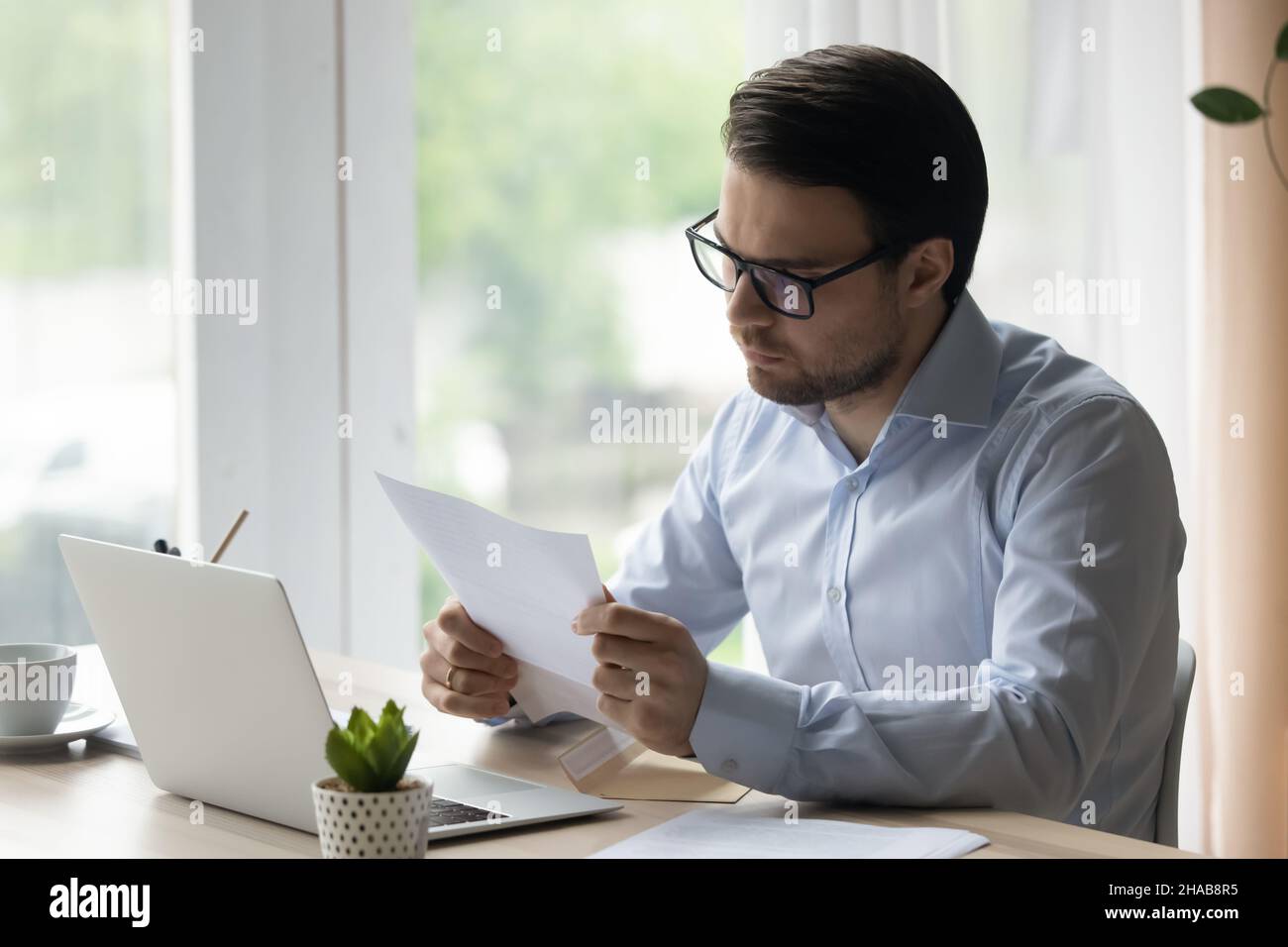 Young business man sorting out hi-res stock photography and images - Alamy