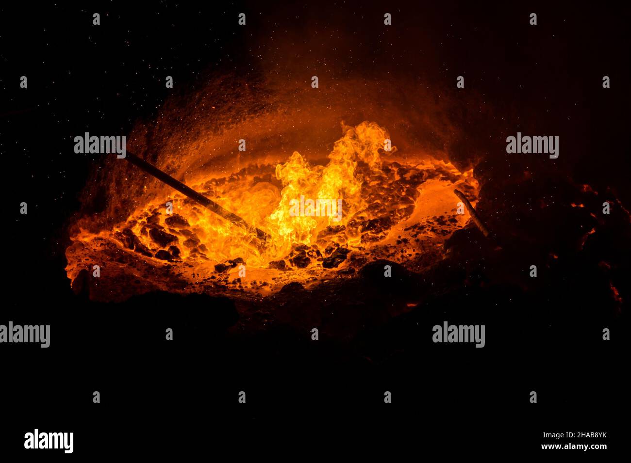 process of taking a sample of liquid metal in a steelmaking furnace ...