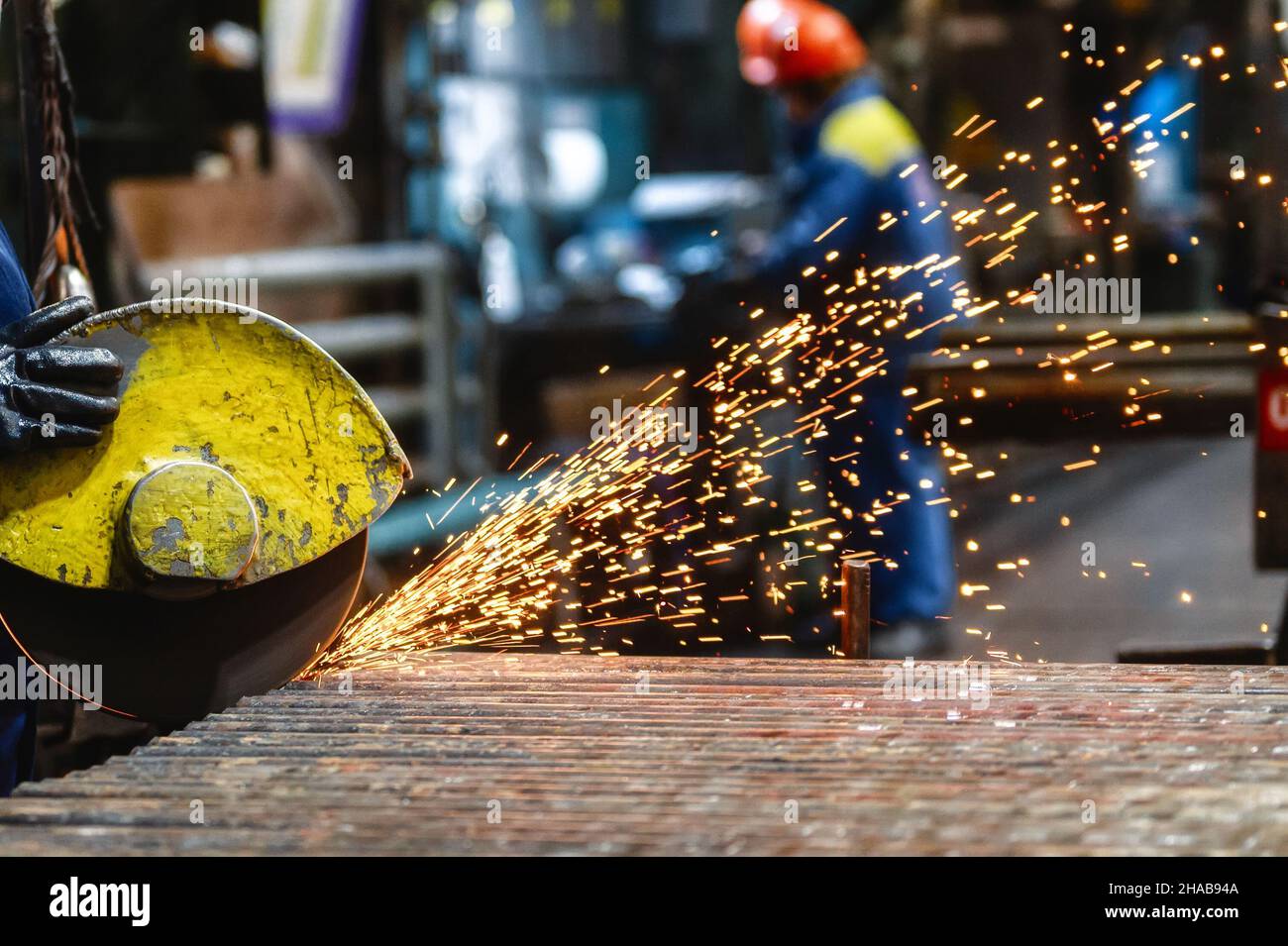 Cutting rolled metal using a powerful abrasive wheel cutting machine ...