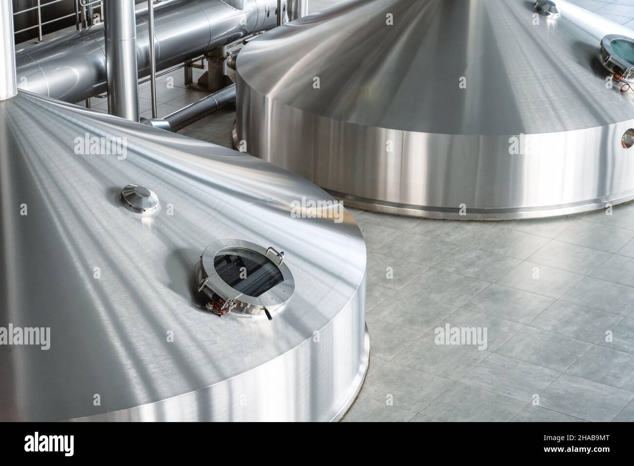 Mash vats of a brewery. Large metal fermentation tanks Stock Photo - Alamy