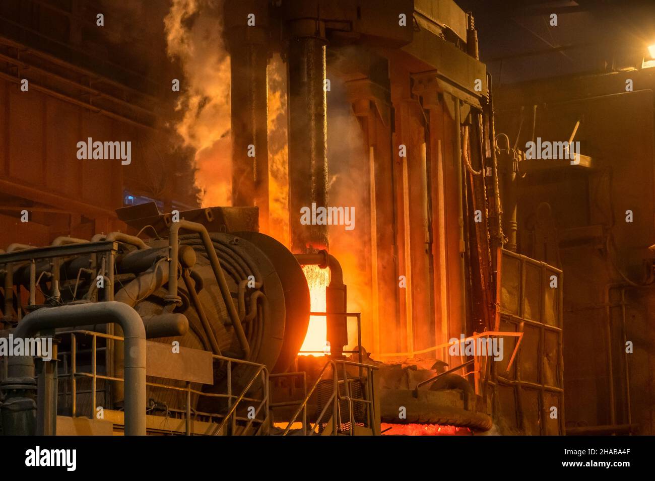 Electric arc furnace during operation. Lots of smoke and fire Stock ...