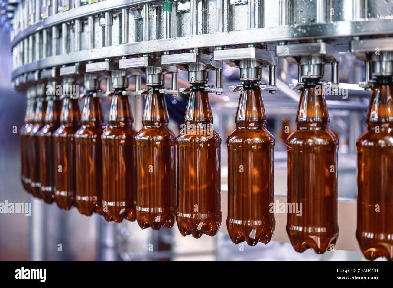 Large filling machine, the process of filling plastic bottles with ...