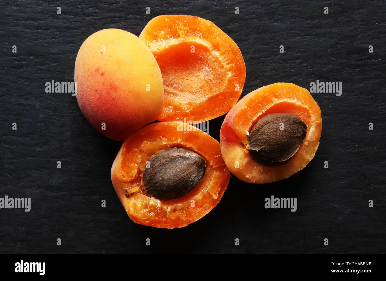 Photography of apricots open and cut in halves and apricots kernels for ...