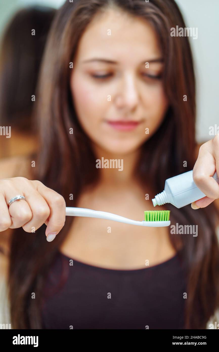 Squeezing toothpaste hi-res stock photography and images - Alamy