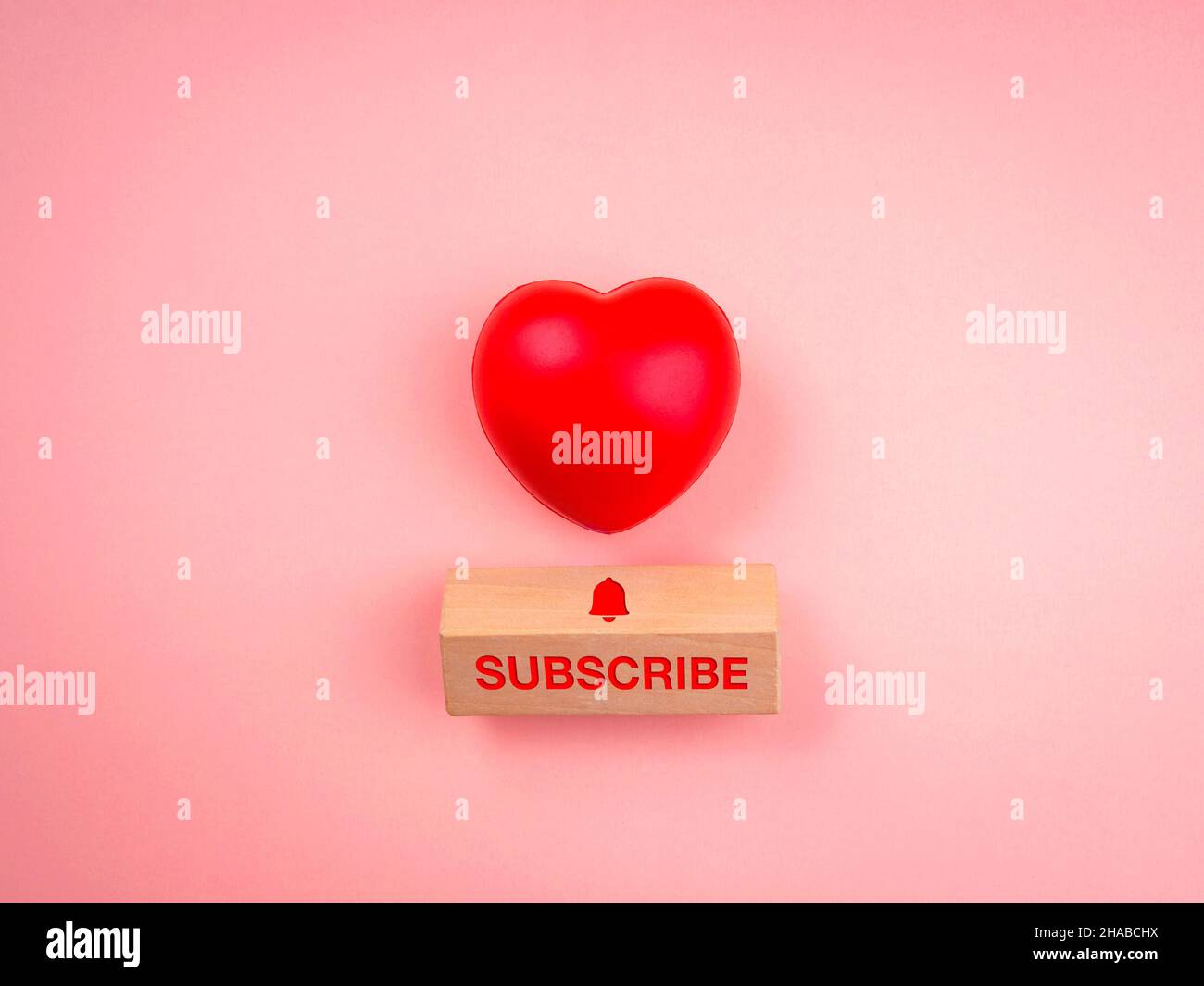 Subscribe concept. Word "SUBSCRIBE" and bell icon on wooden cube block ...