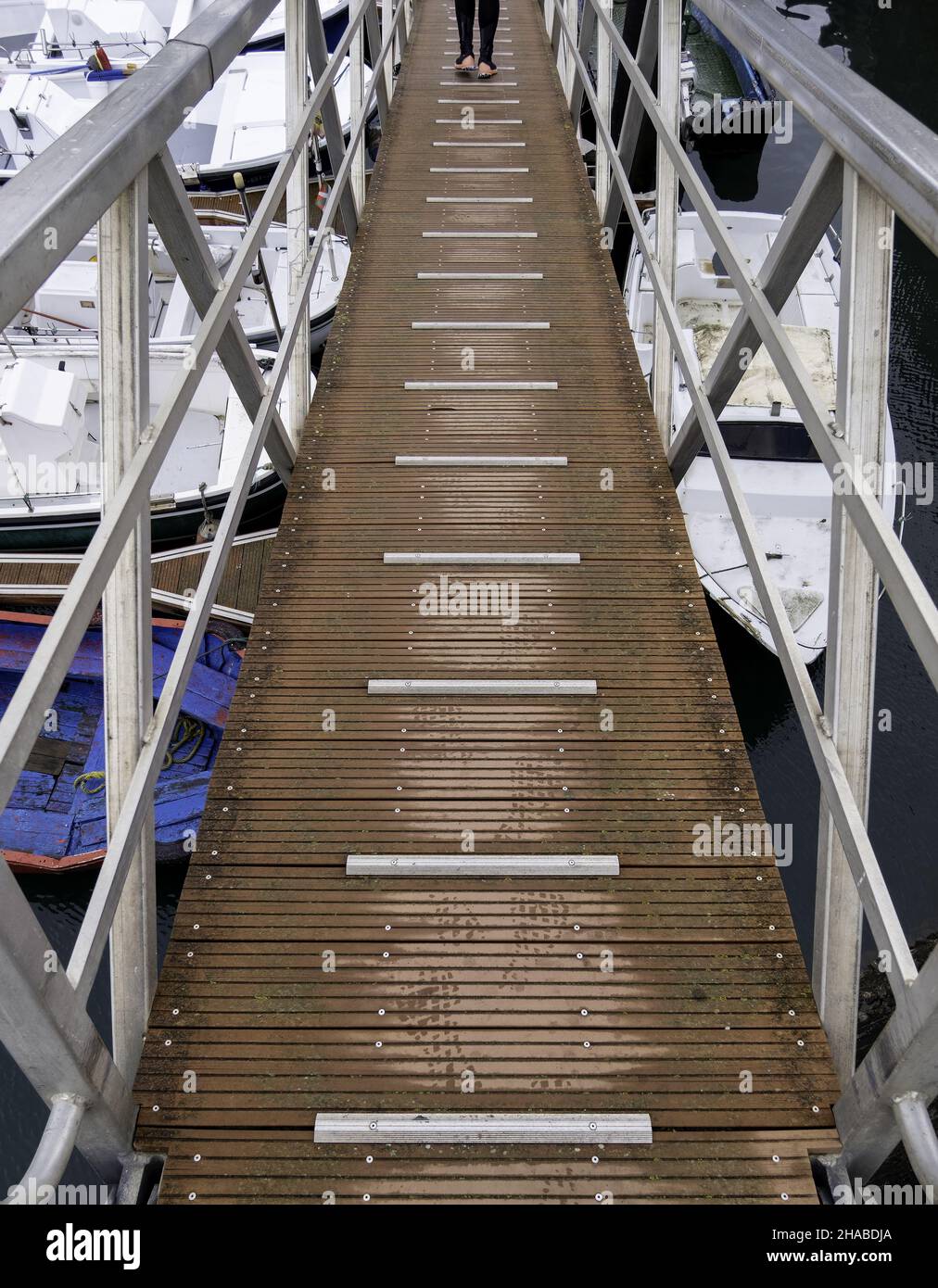 Bridge in fishing port with boats, industry and transport Stock Photo ...