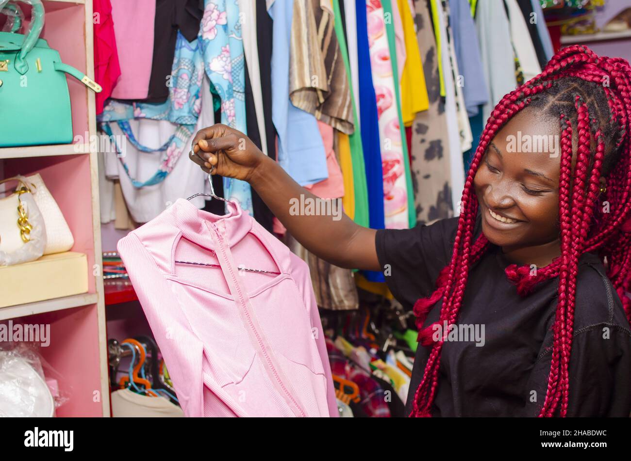 A black beautiful Nigerian girl with rasta red hair explore Batik ...