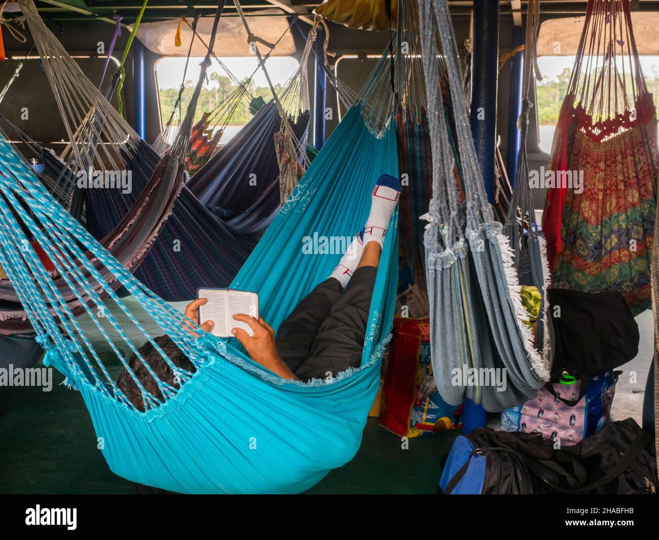 Amazon River, Peru - Decemberr 9, 2019: Man praying while laying on ...