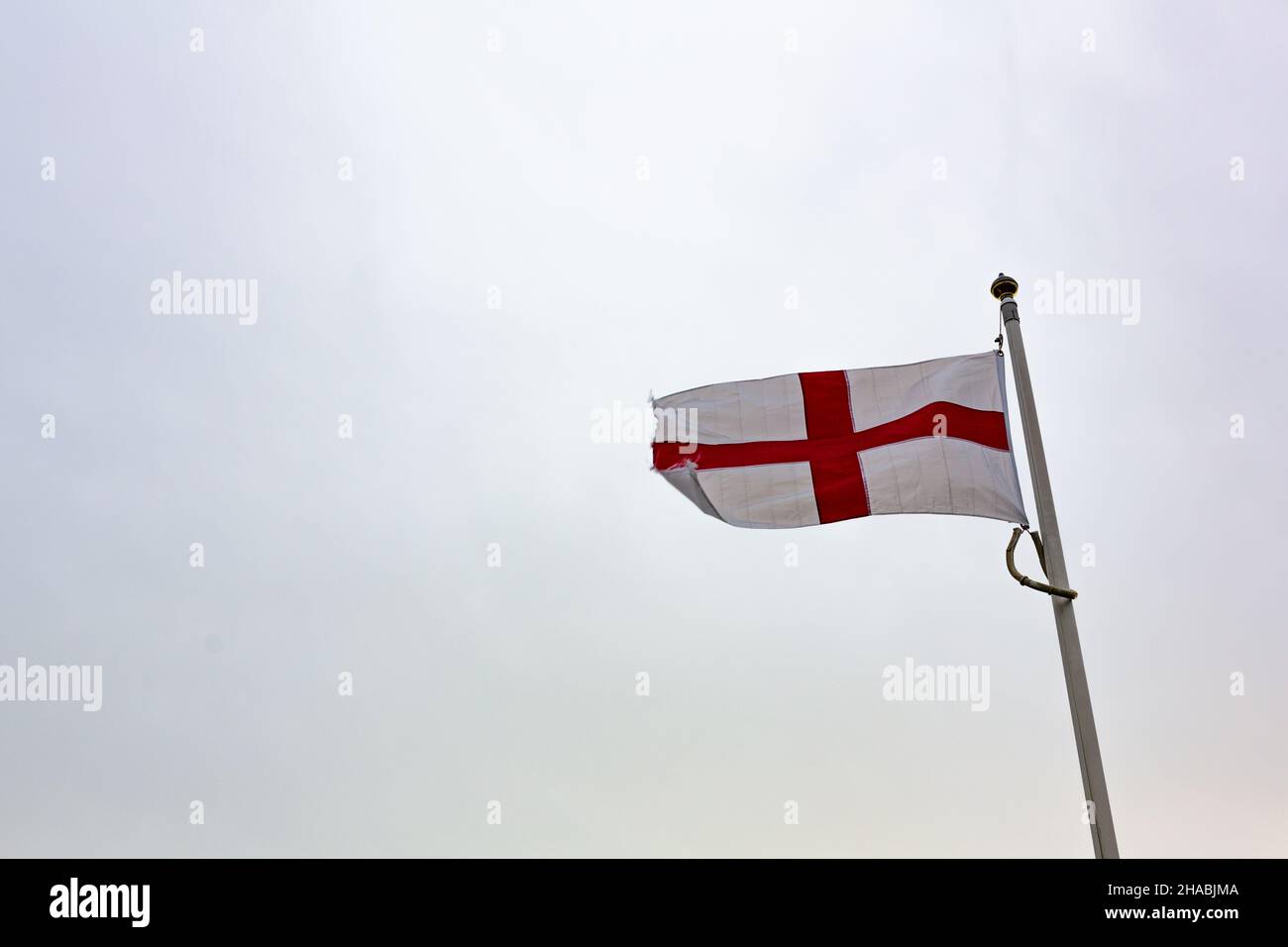 St George's cross flag isolated against a pure white sky Stock Photo ...